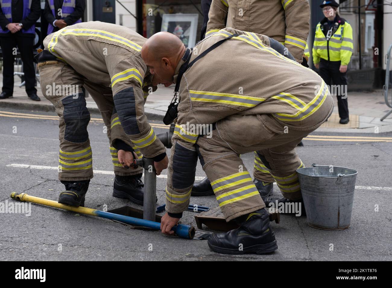 Well in street has been opened and a fire hydrant is connected, a ...