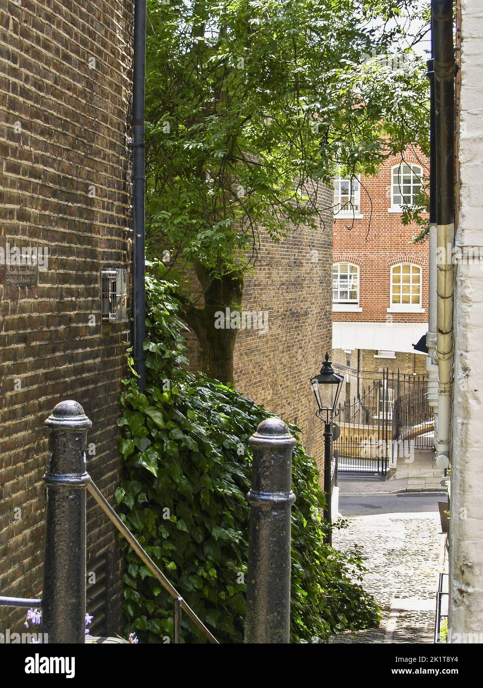 Looking down to street below between buildings in London UK Stock Photo ...