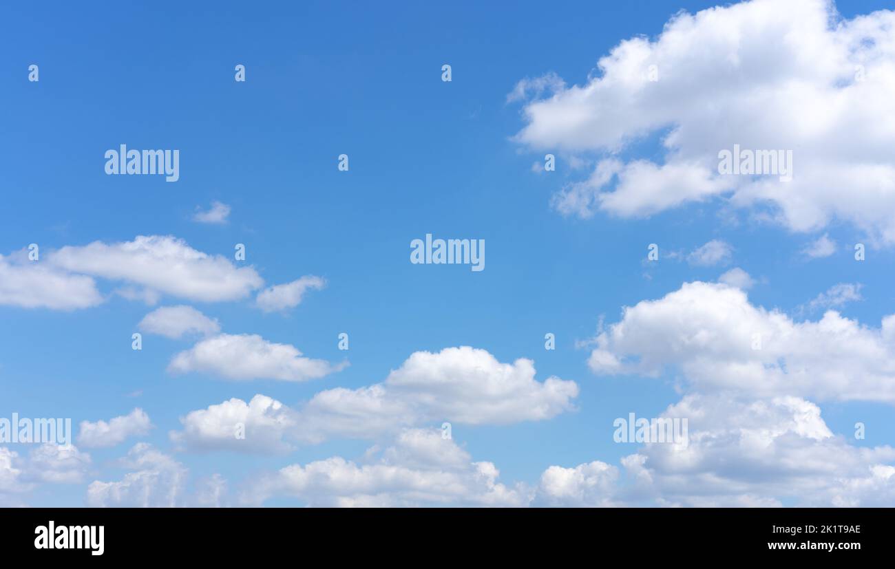 Clear blue sky background with white clouds Stock Photo - Alamy