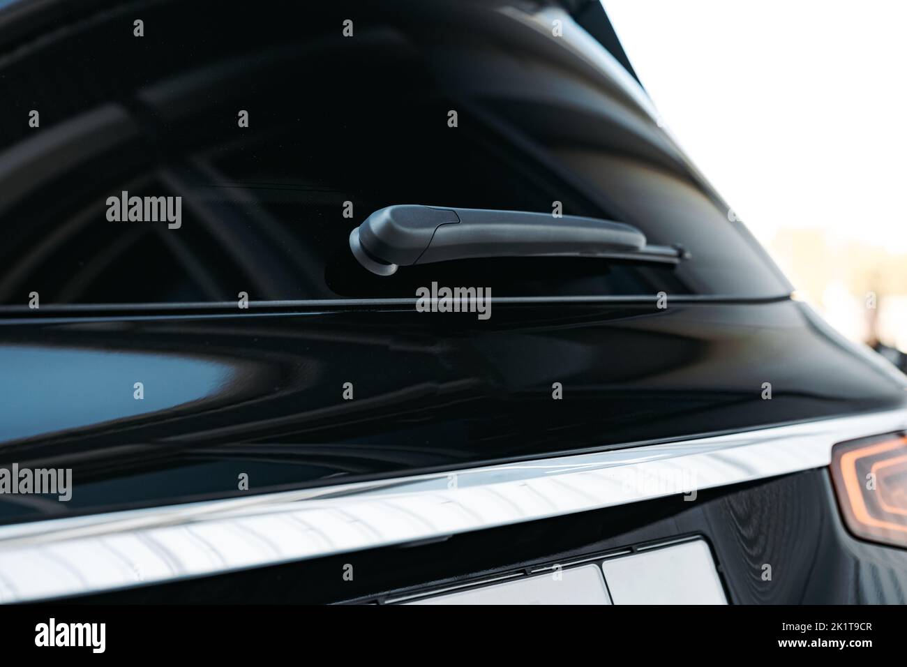 The car rear wiper of a new black luxury car Stock Photo - Alamy