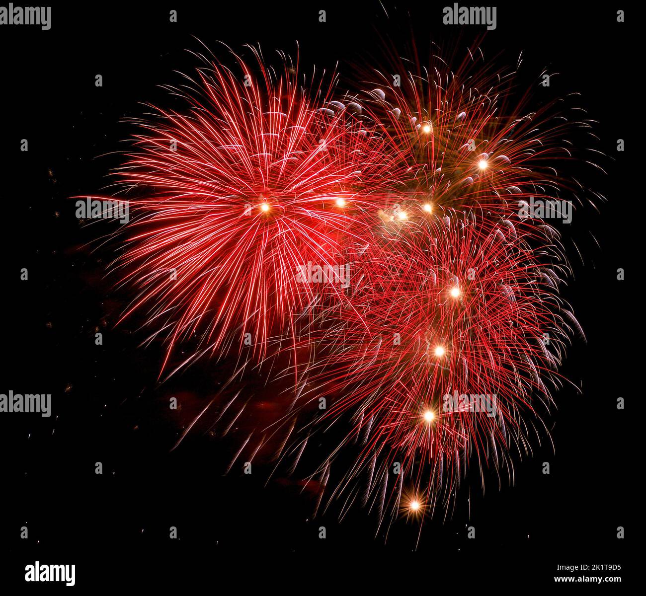 Golden orange red amazing fireworks explosion background in night time ...