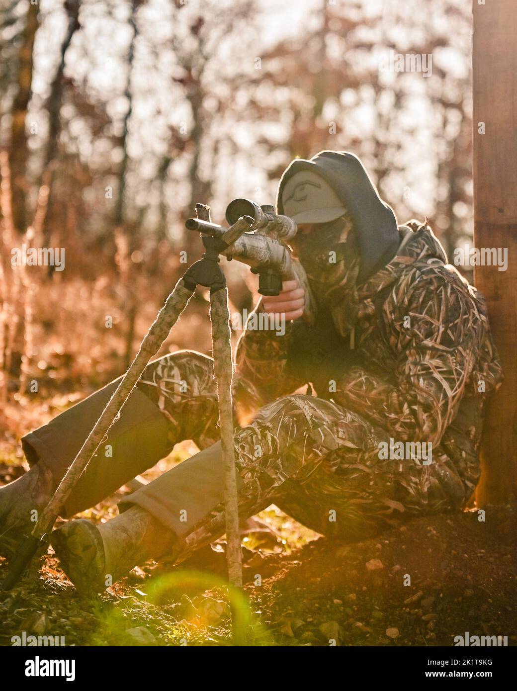 A hunter aiming his gun at the prey Stock Photo - Alamy