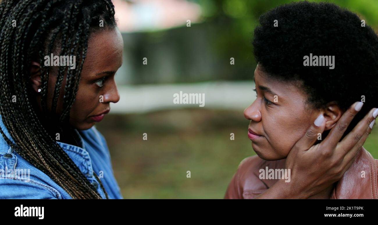Depressed African woman, friend helping compassionate hug Stock Photo ...