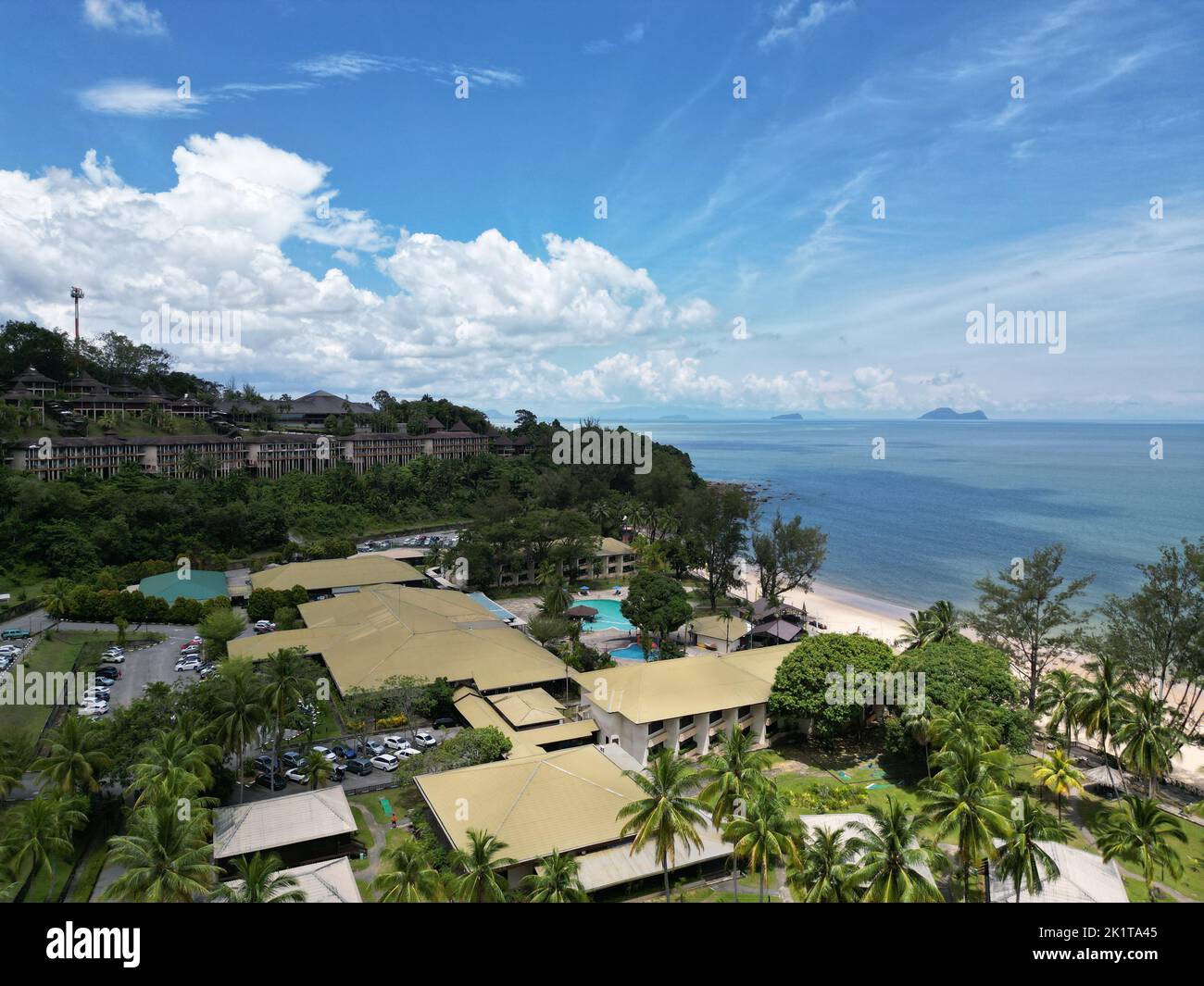 An aerial view of the ocean surrounded by beautiful greenery and ...