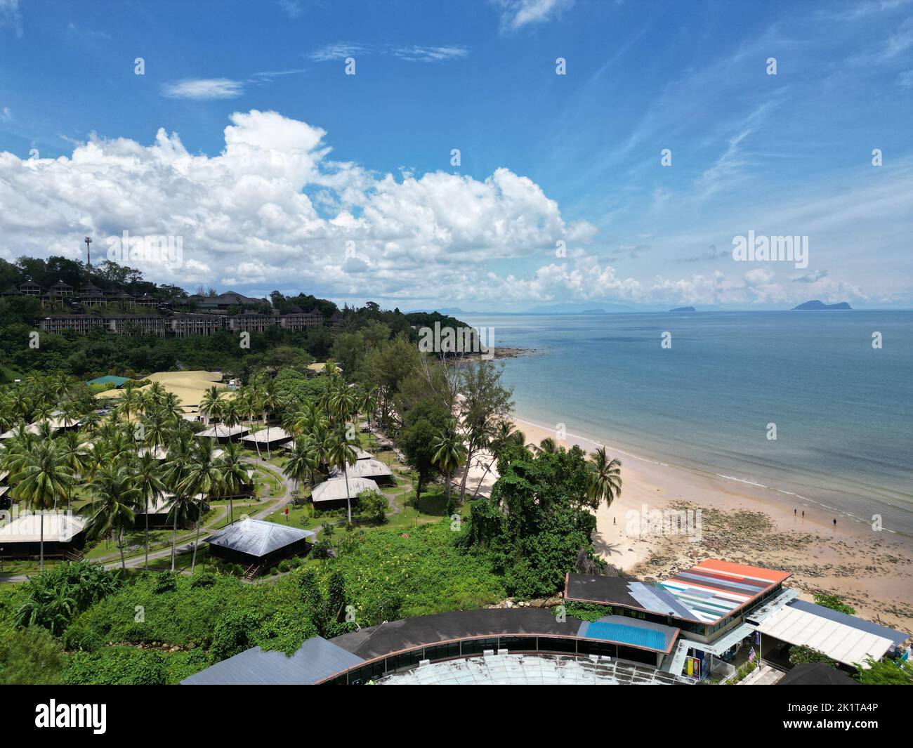 An aerial view of the ocean surrounded by beautiful greenery and ...