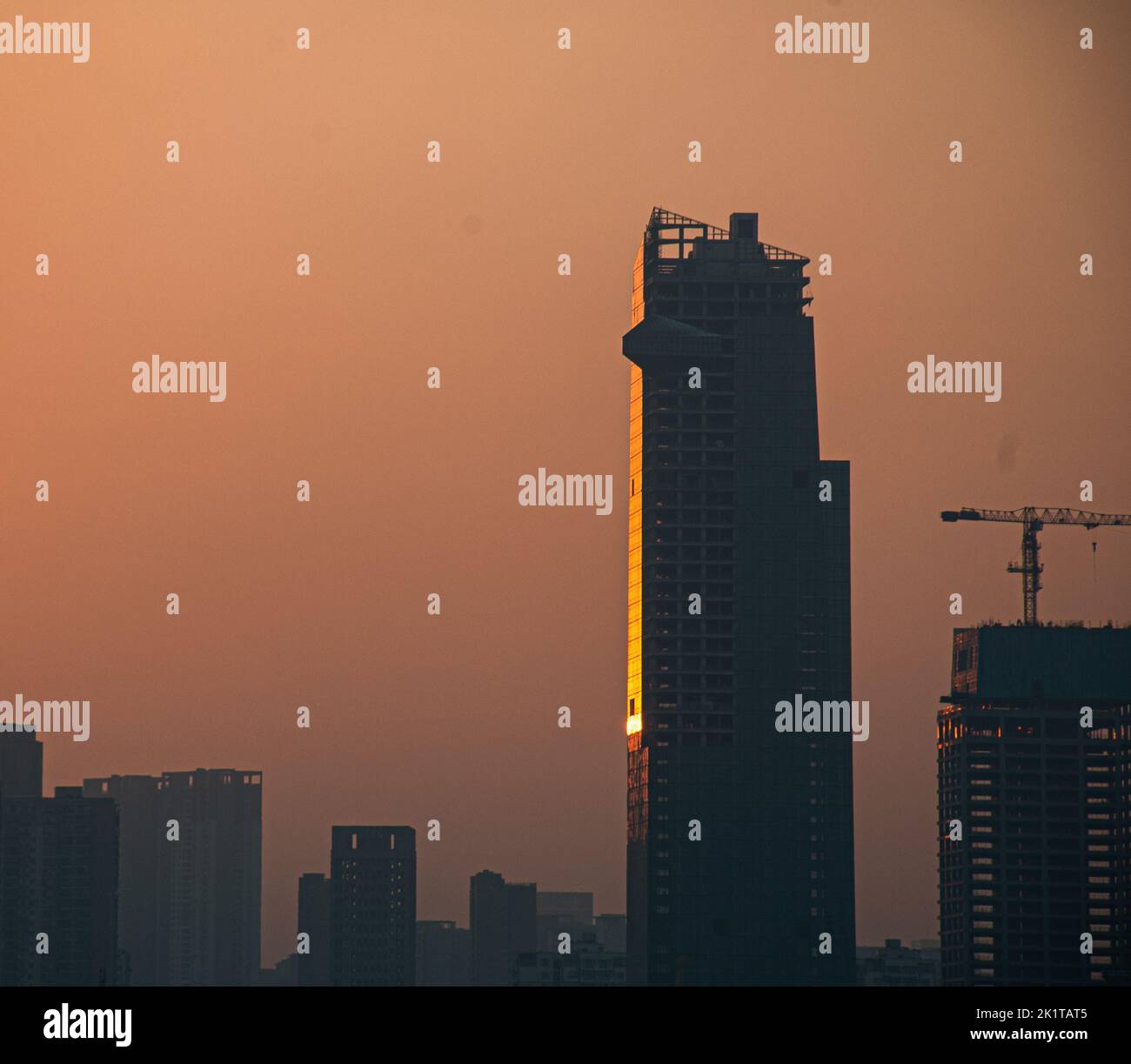 A skyscraper silhouette during sunset Stock Photo - Alamy