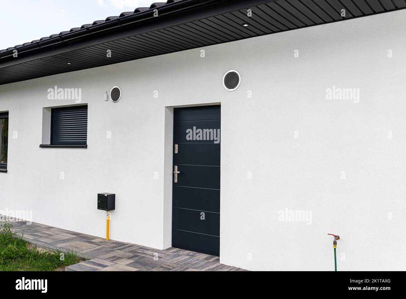 Air intake and exhaust in the wall of a single family house for ...