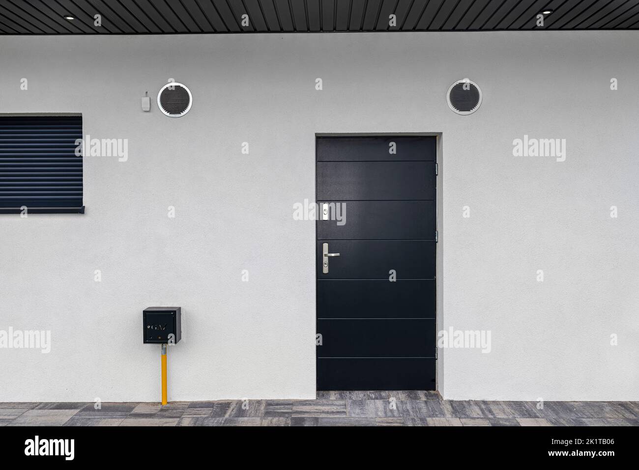 Air intake and exhaust in the wall of a single family house for ...