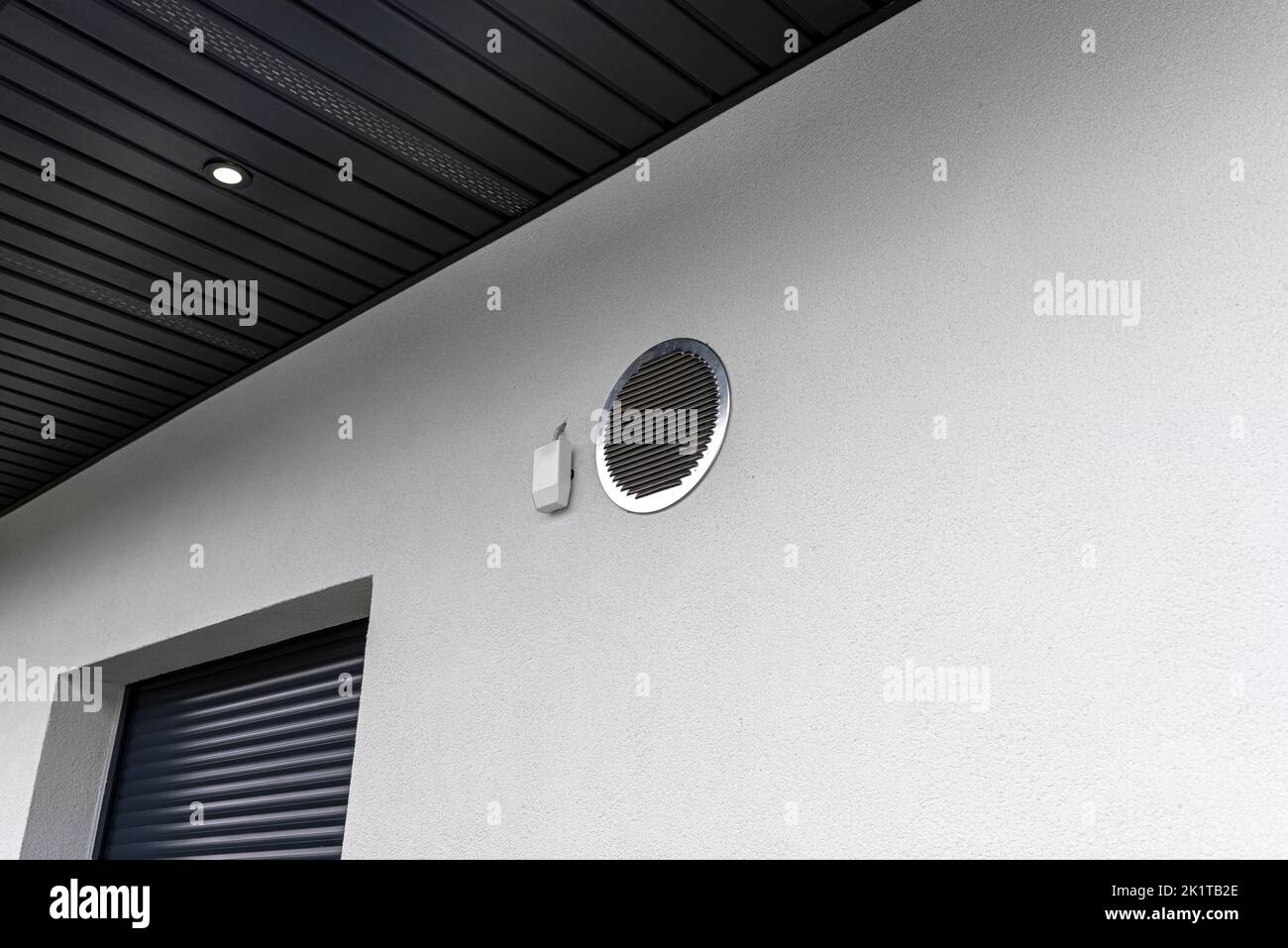 Air intake and exhaust in the wall of a single family house for ...