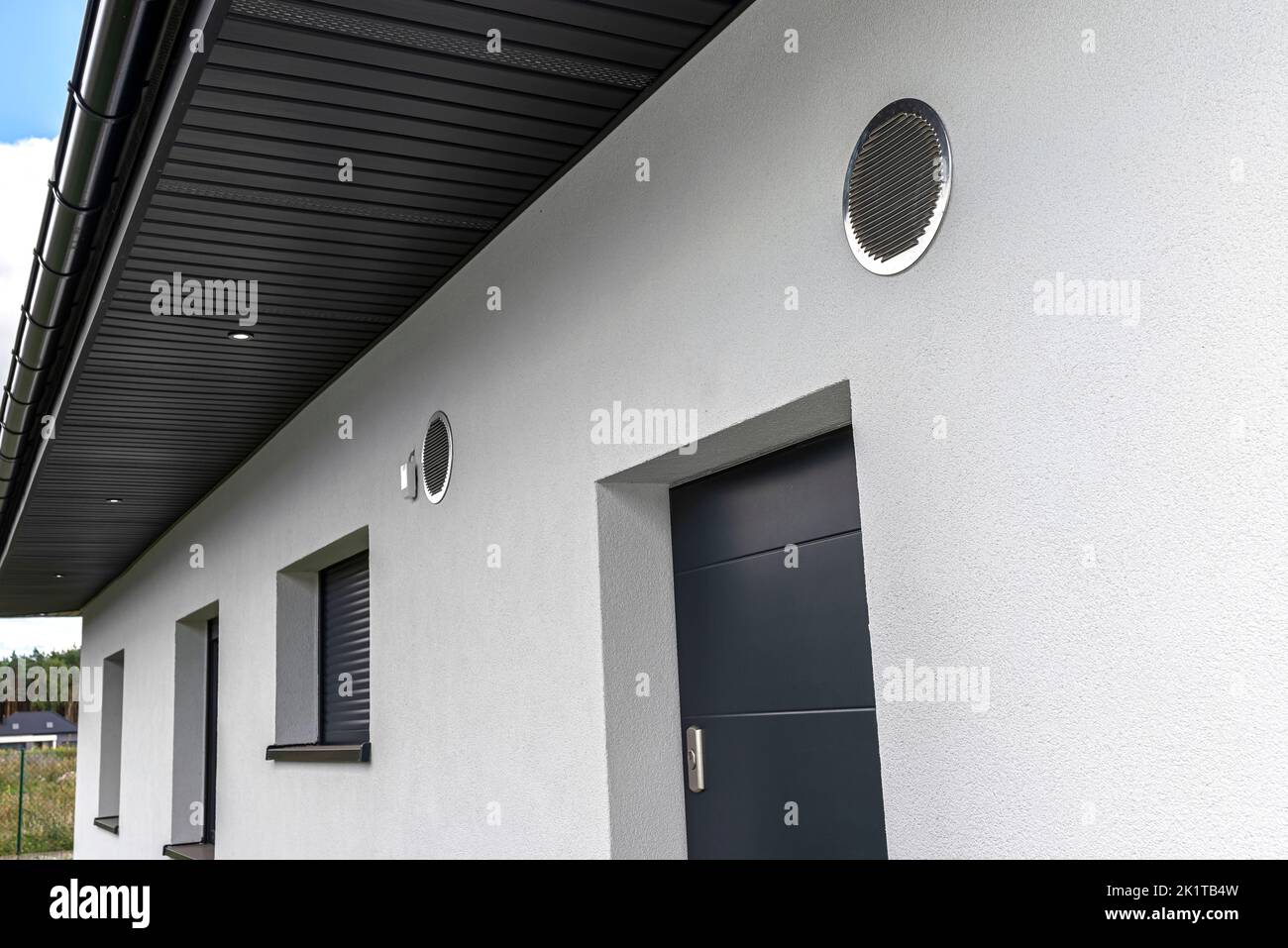 Air intake and exhaust in the wall of a single family house for ...