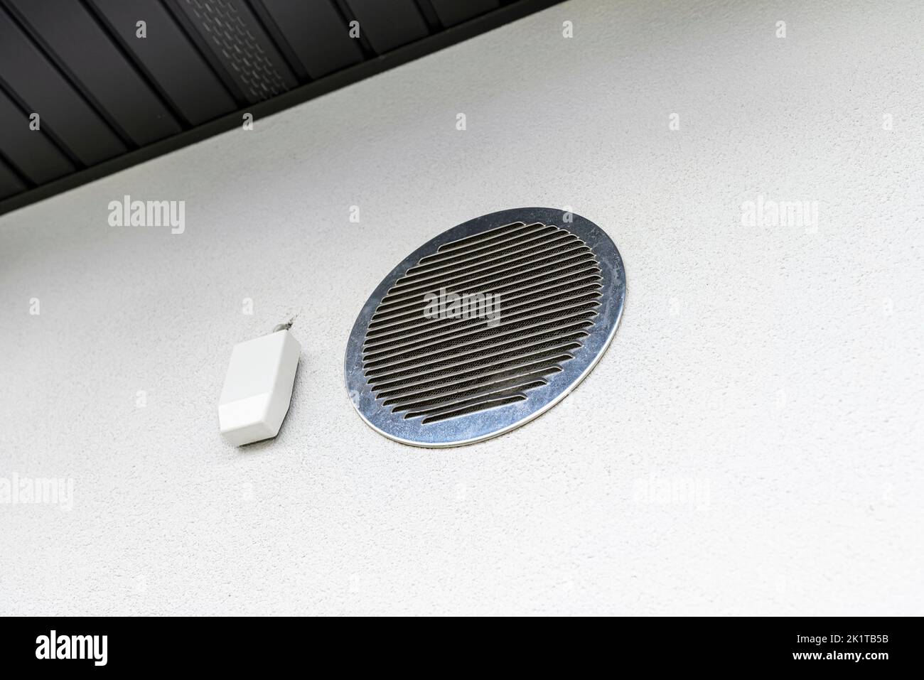 Air intake and exhaust in the wall of a single family house for ...