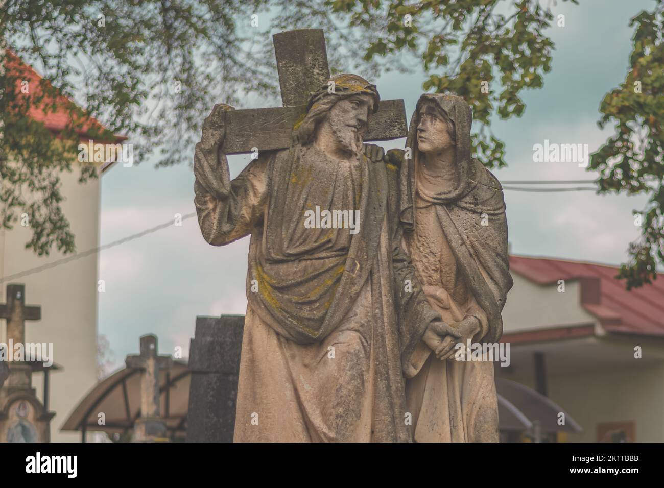 christian religious statue from rock in the cemetery Stock Photo - Alamy
