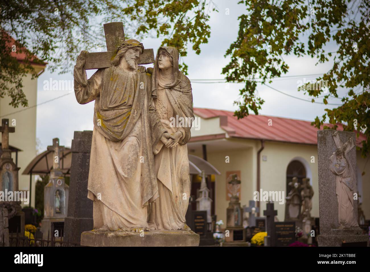 christian religious statue from rock in the cemetery Stock Photo - Alamy
