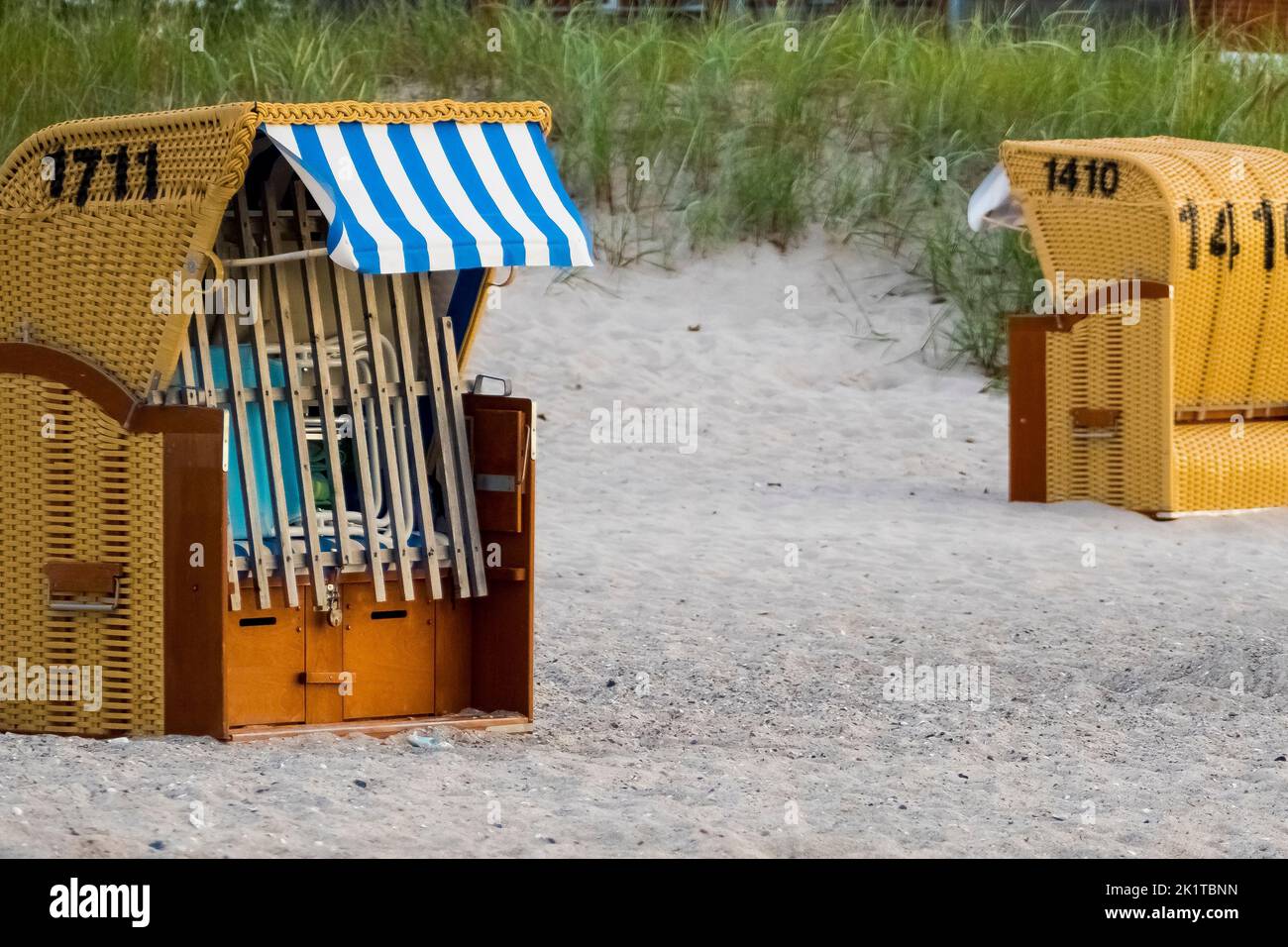 A close-up shot of beach boxes on the sand Stock Photo - Alamy