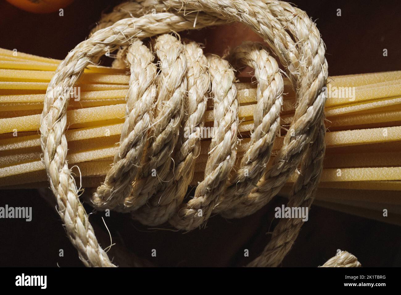 A closeup of a pasta tied up with a rope Stock Photo - Alamy