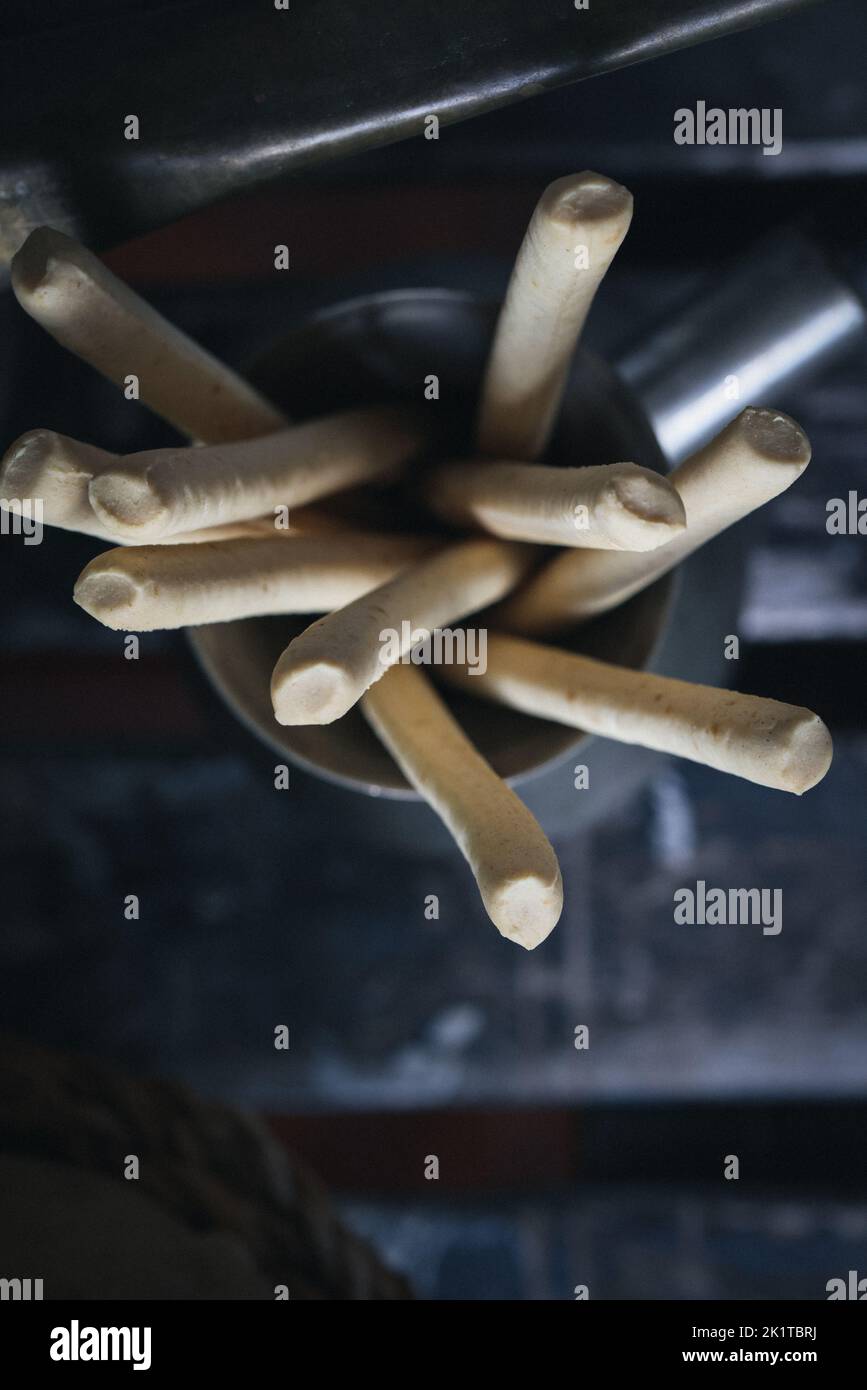 A vertical top view of breadsticks in a silver container Stock Photo ...