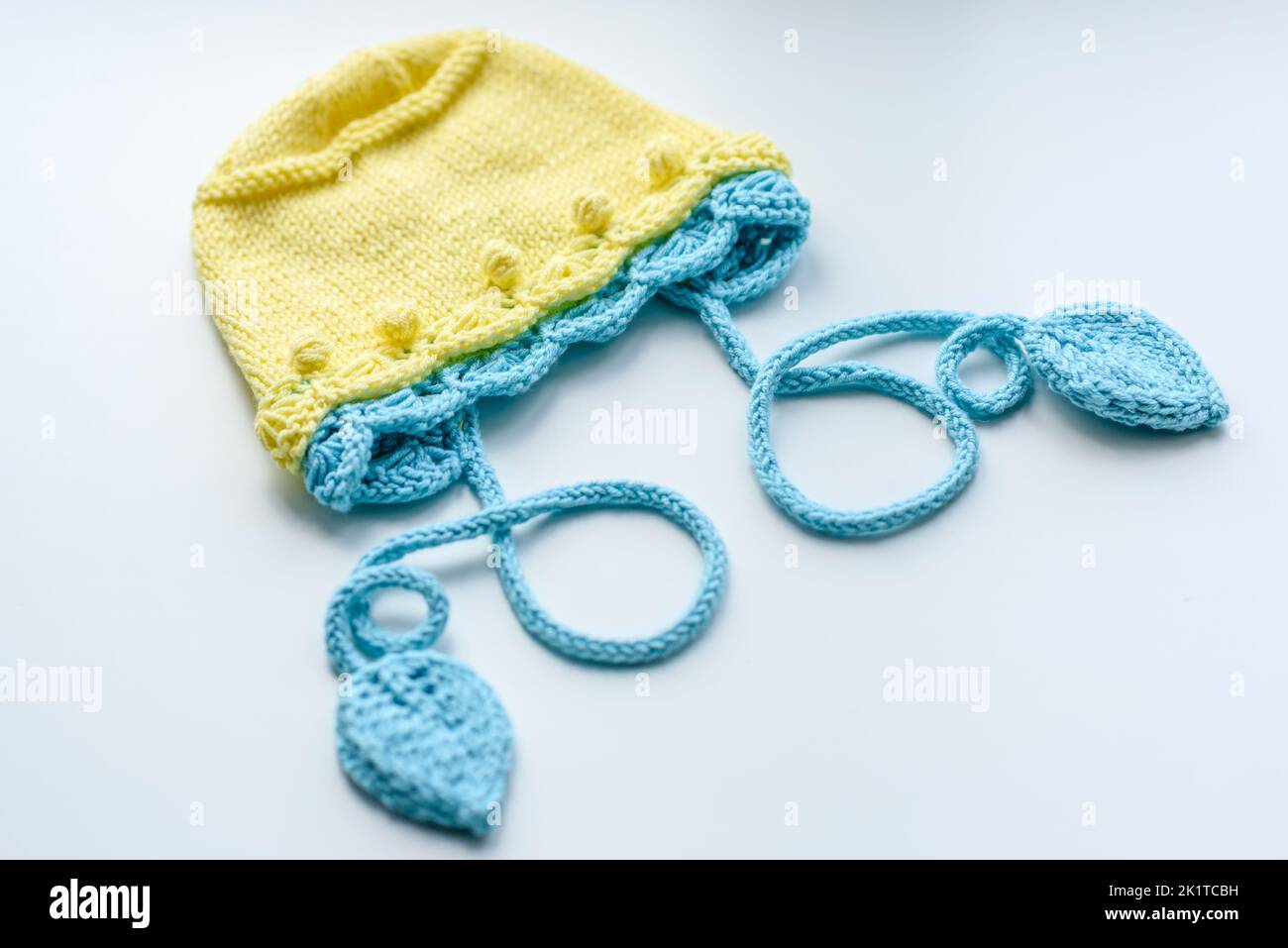 Beautiful baby knitted clothes and a toys for a newborn baby. Hobby ...