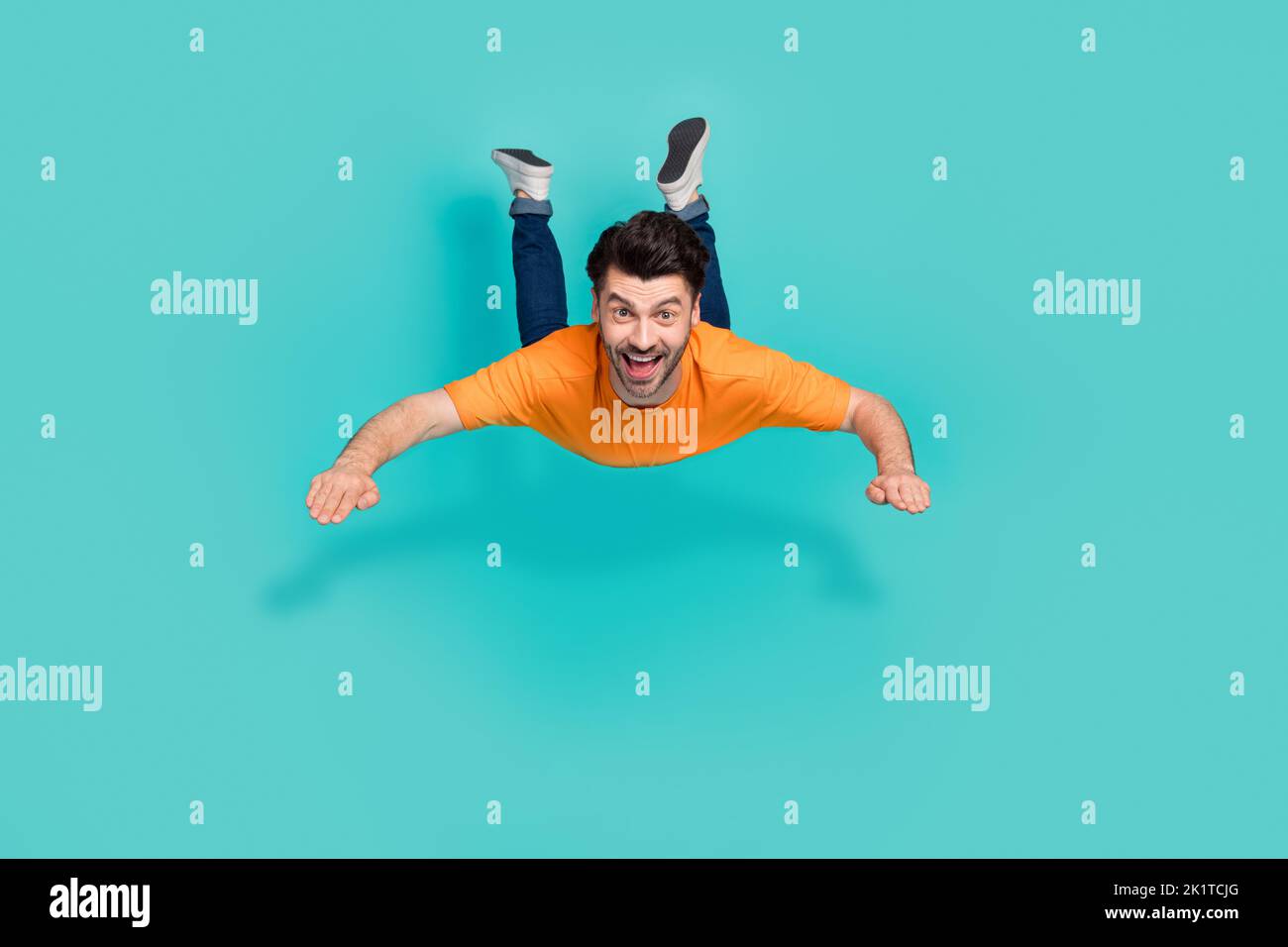 Full length photo of guy flying in air falling down virtual game ...