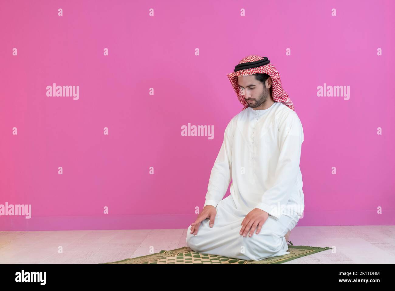 Young muslim man praying salat during Ramadan Stock Photo - Alamy