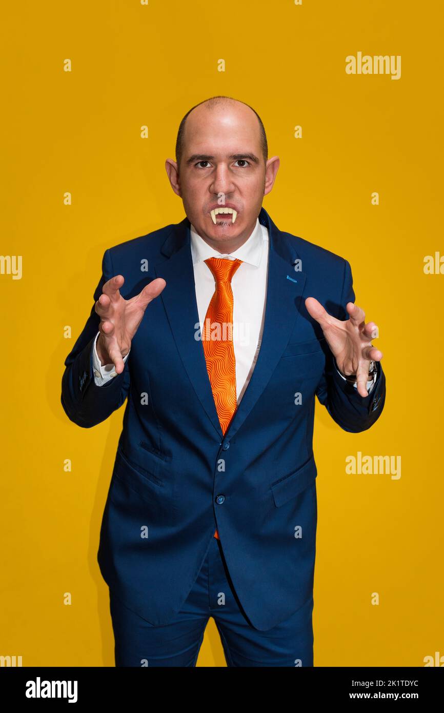 A smiling bald adult Caucasian male Caucasian man dressed in a blue ...