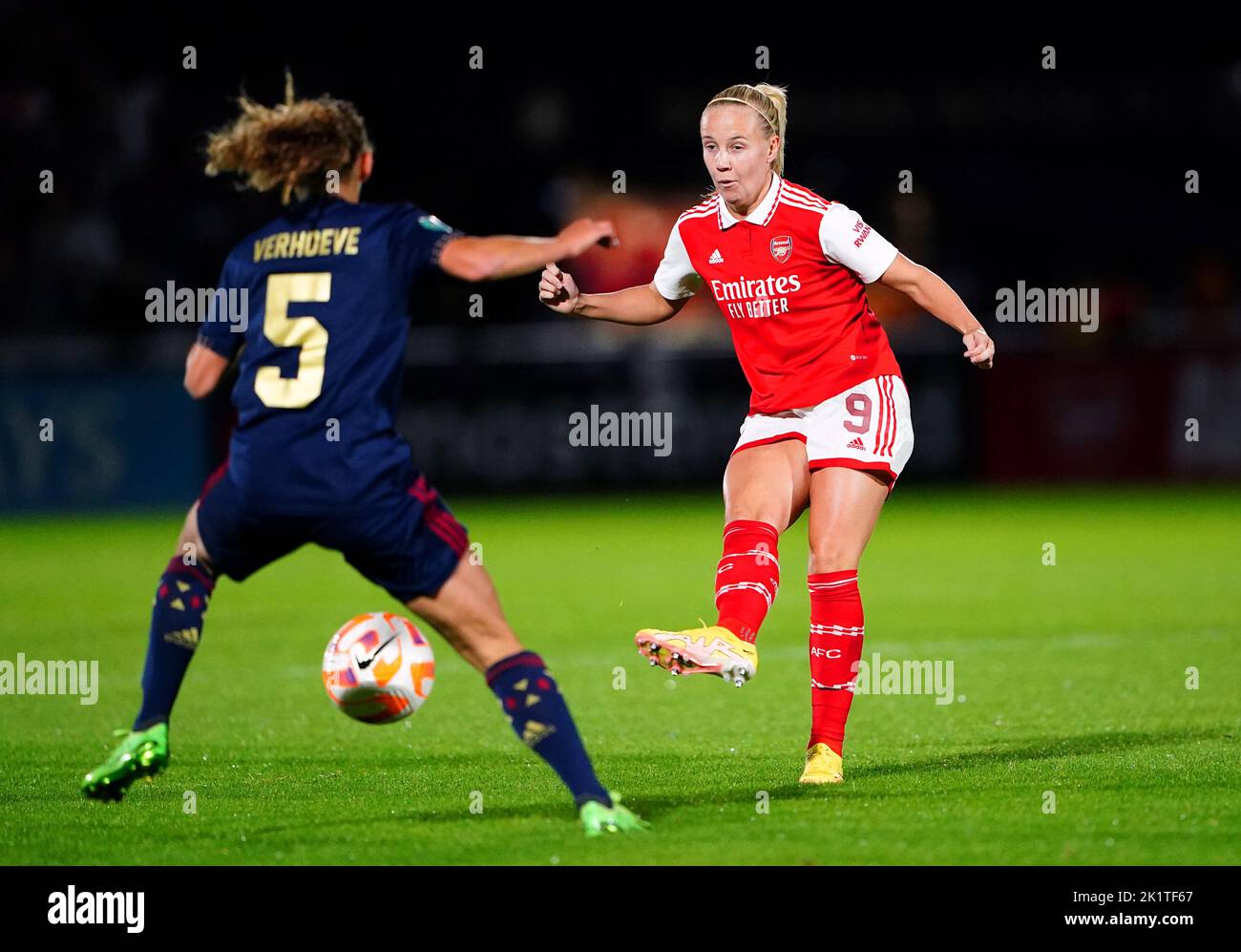 Arsenal's Beth Mead (right) shoots the ball past Ajax's Soraya Verhoeve ...