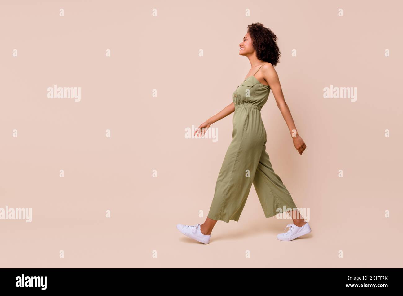 Side profile photo of cheerful nice woman with wavy hairdo dressed ...