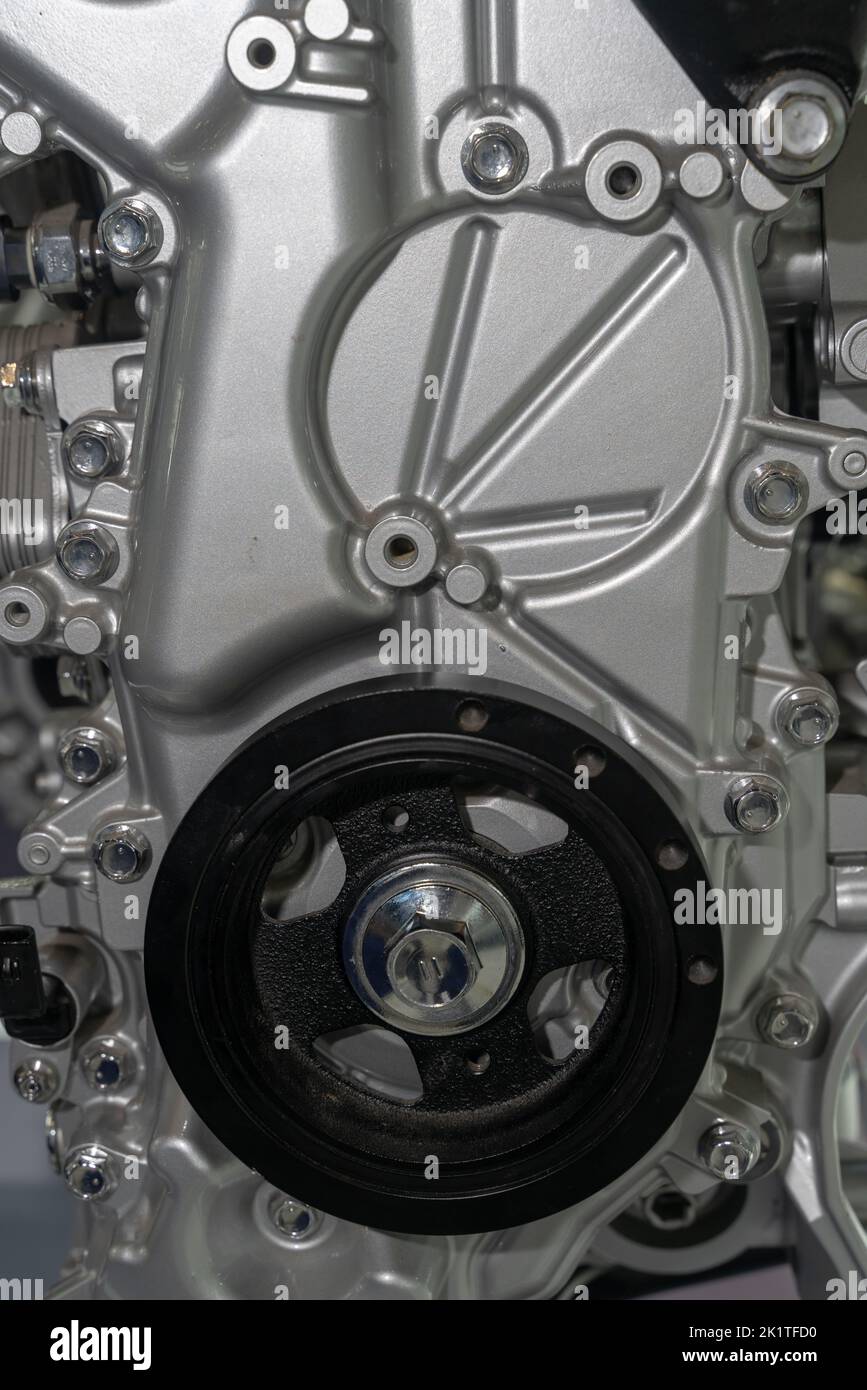 A vertical shot of a modern automobile vehicle engine and spare parts ...