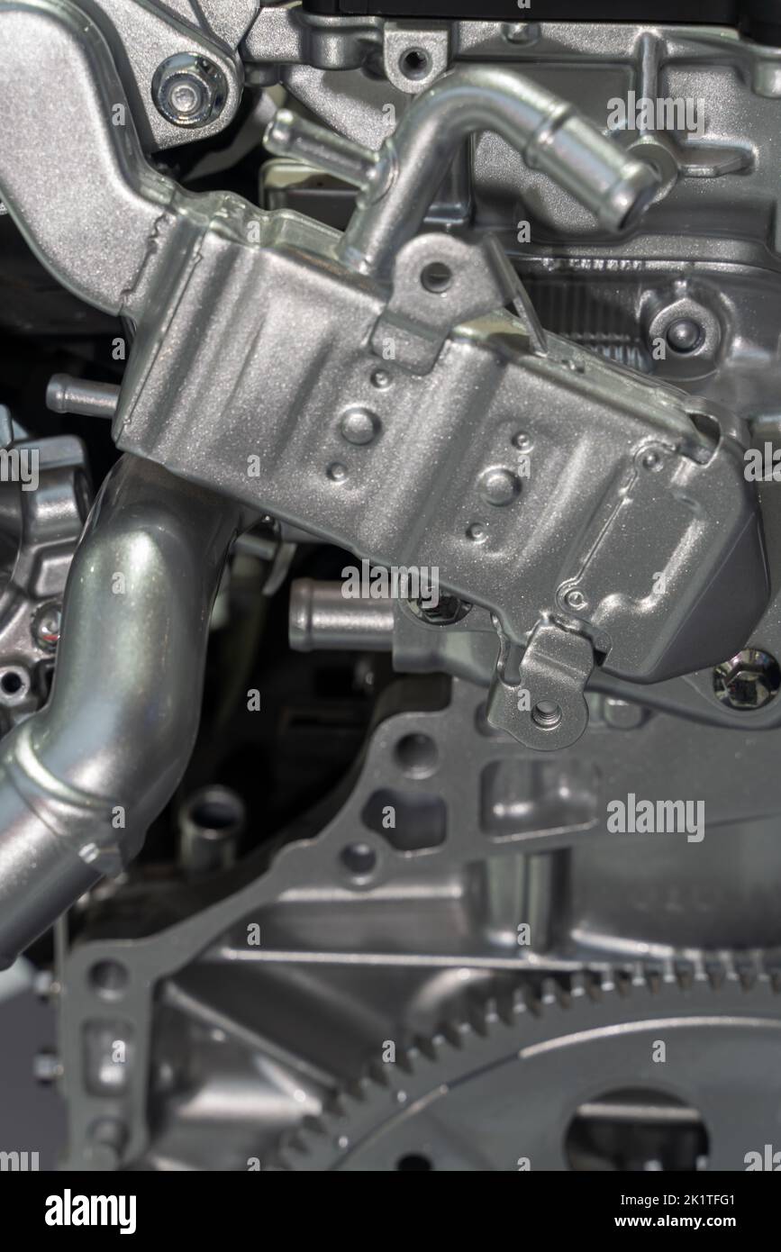 A vertical shot of a modern automobile vehicle engine and spare parts ...