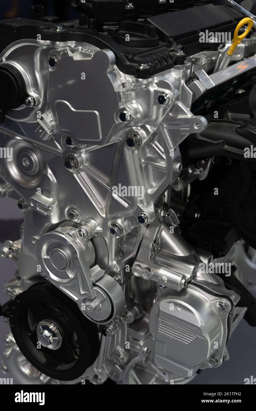 A vertical shot of a modern automobile vehicle engine and spare parts ...
