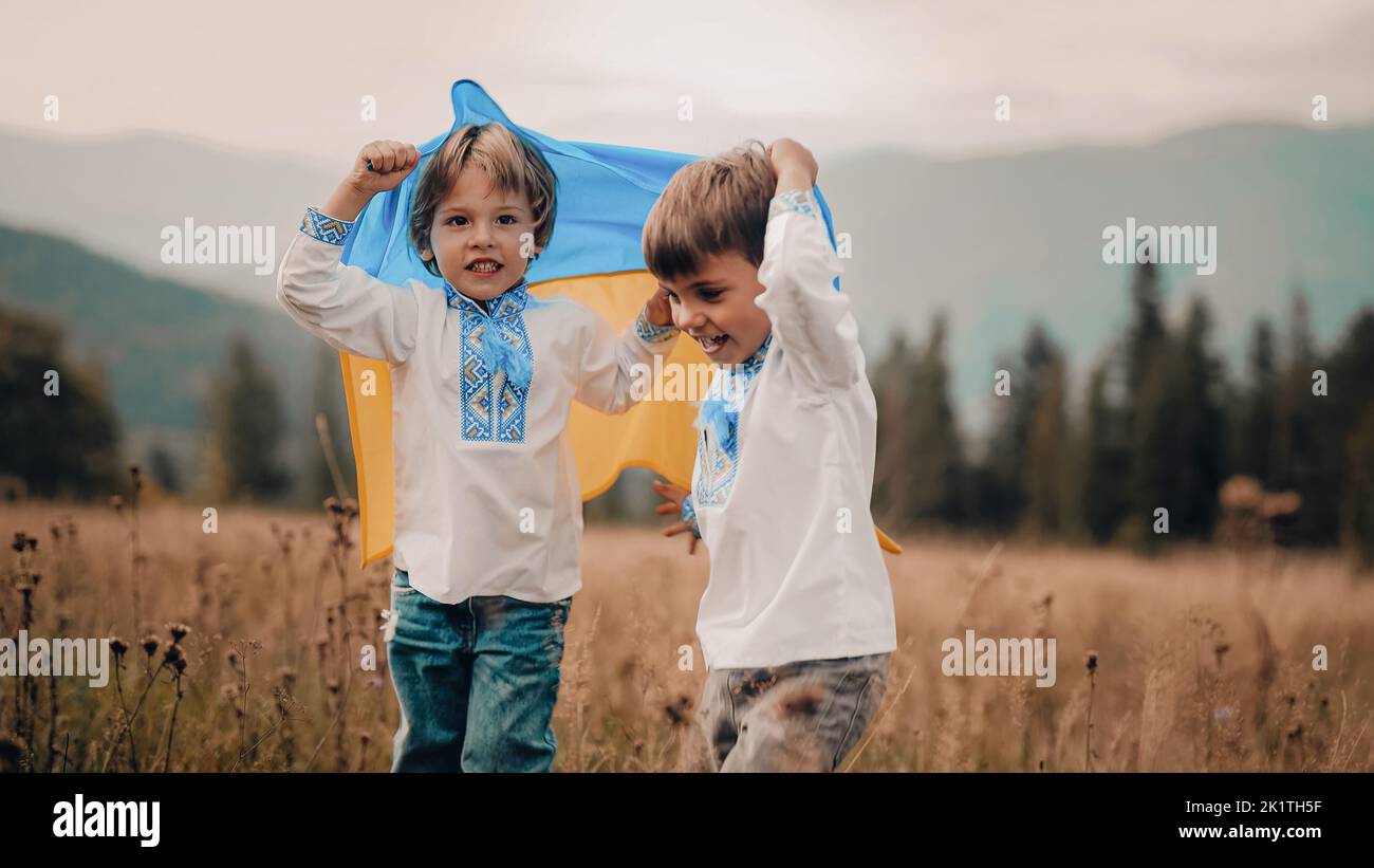 Happy glad boys - Ukrainian patriots children jumping, rejoyces with ...