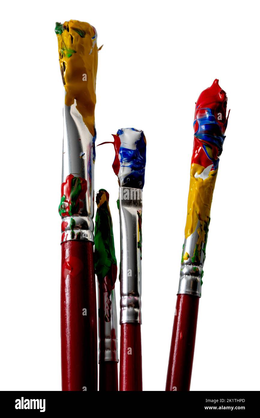 Dirty paintbrush covered in acrylic paint isolated on white background ...