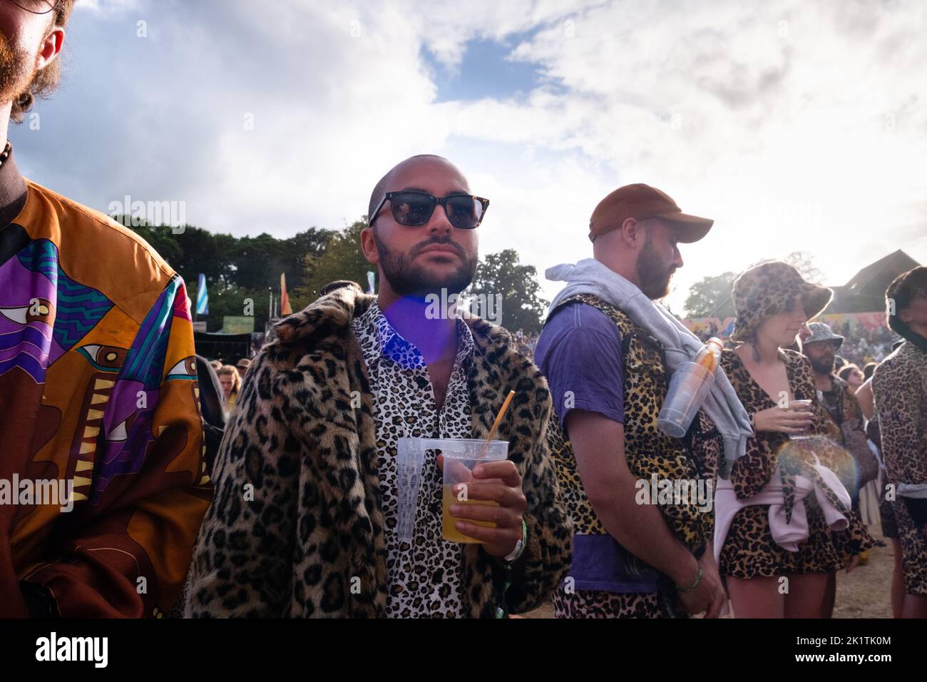 Beer time in festival crowd at the Green Man 2022 music festival in ...