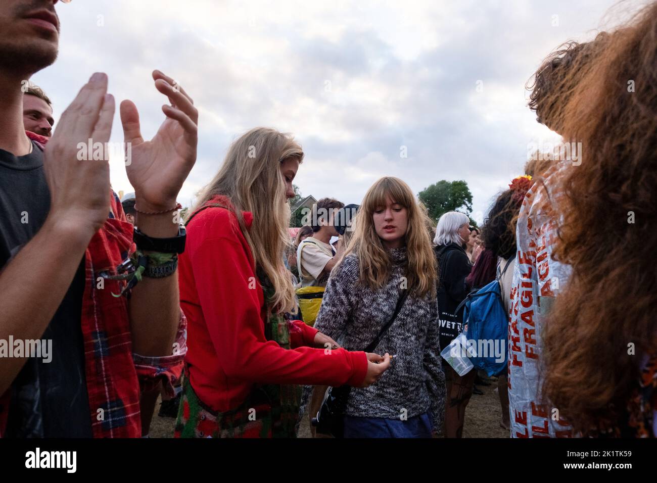 Sharing a cigarette in the festival crowd at the Green Man 2022 music ...