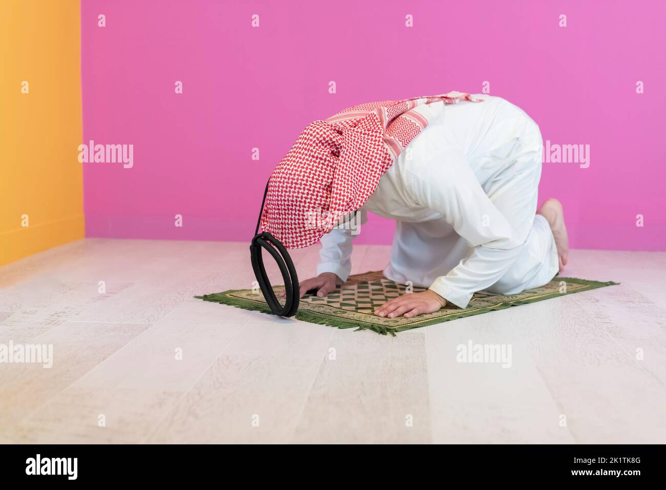 Young muslim man praying salat during Ramadan Stock Photo - Alamy