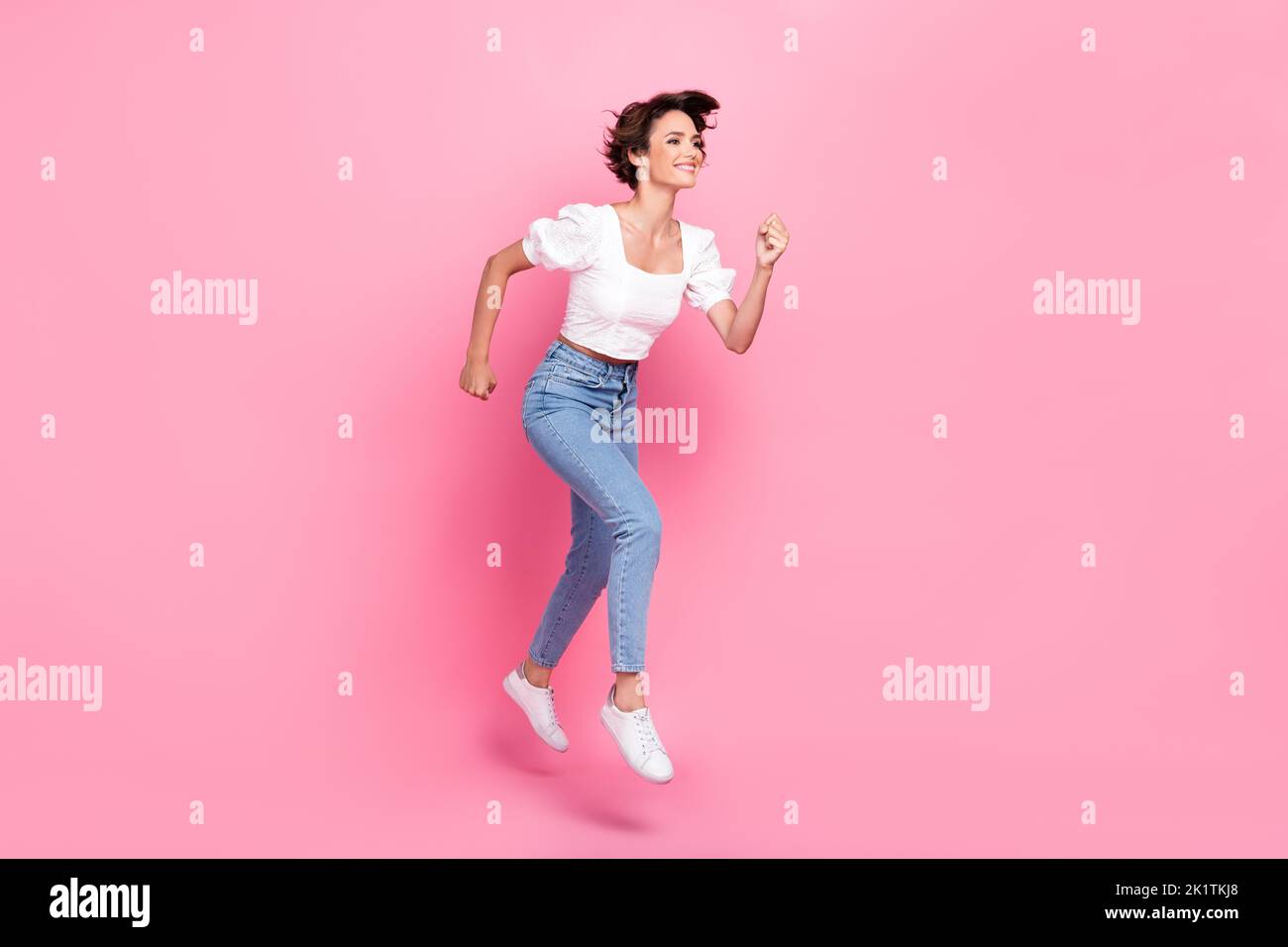 Full length photo of slim adorable lady wear white crop top jumping ...