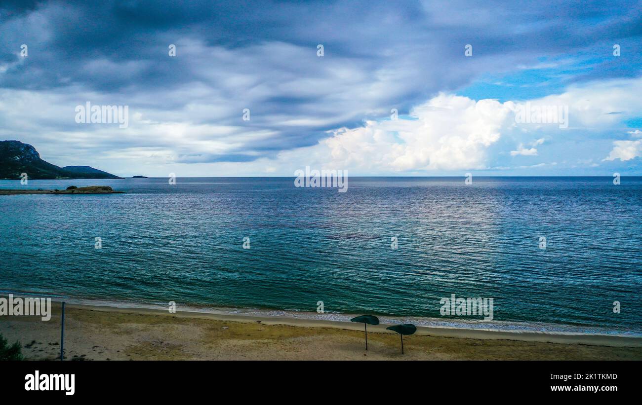 A scenic view of blue cloudy sky over peaceful seascape Stock Photo - Alamy