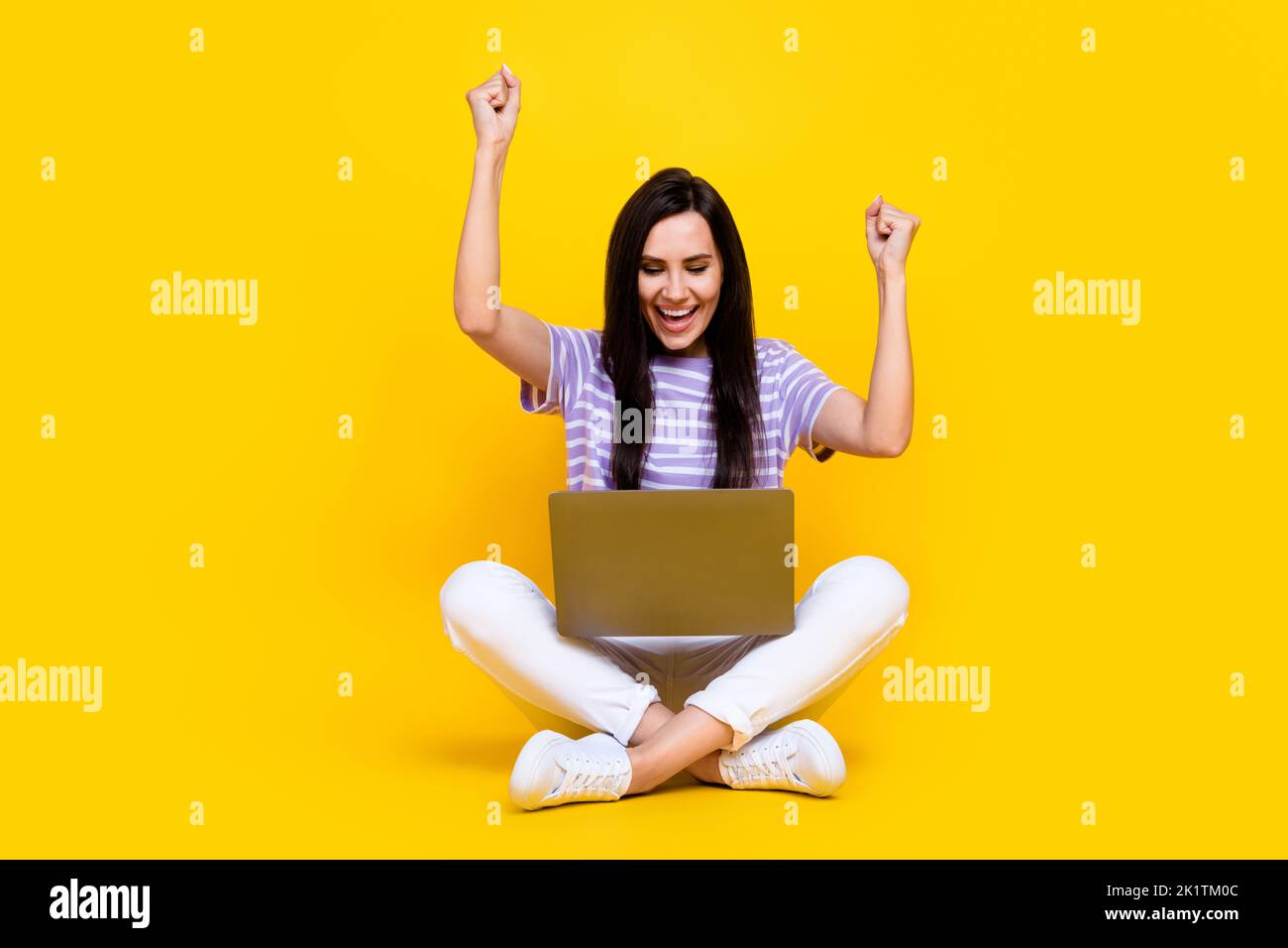 Photo of positive satisfied lady sit empty space raise arm rejoice look ...