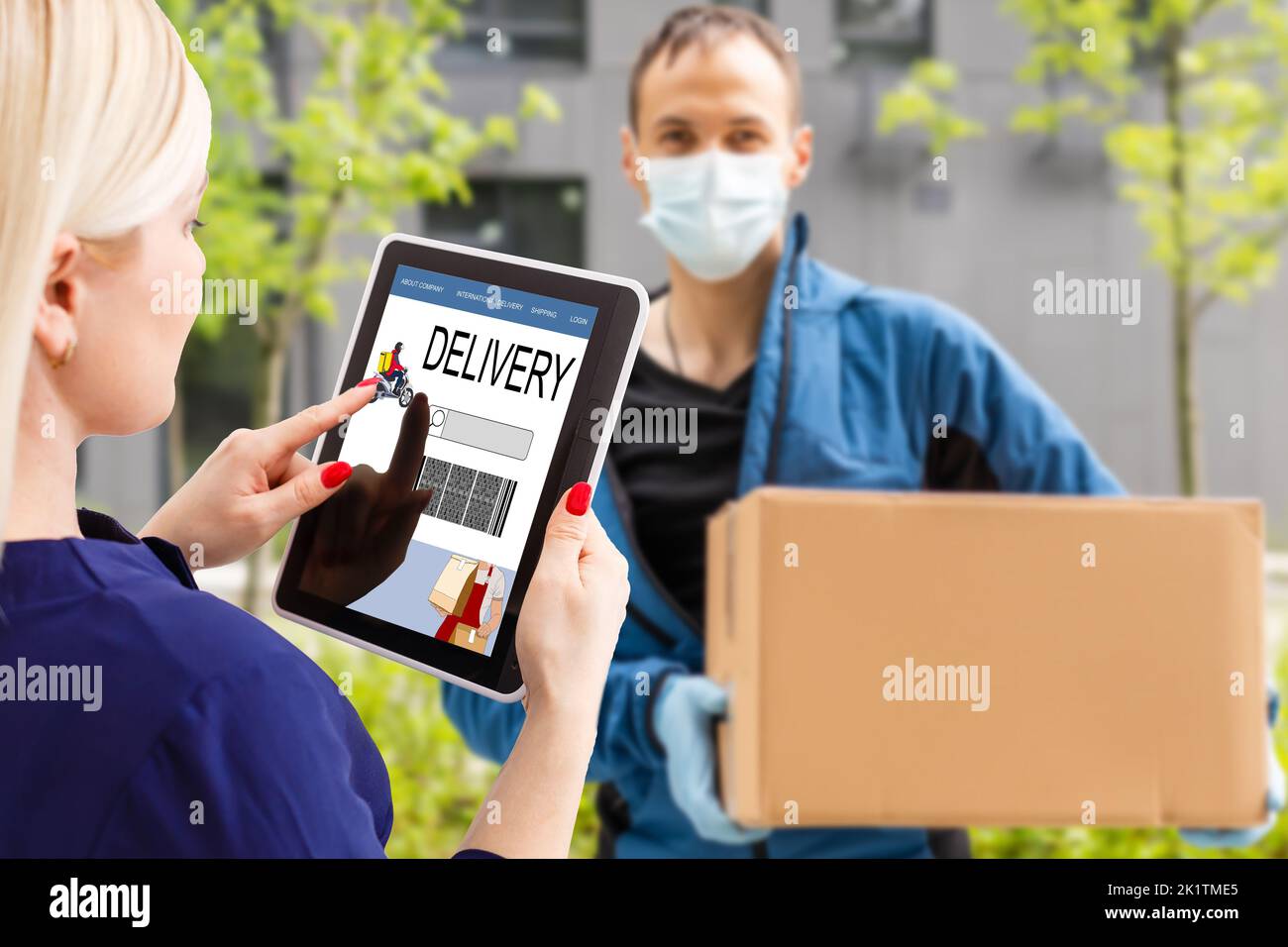 female hands holding tablet with food delivery app on screen Stock ...