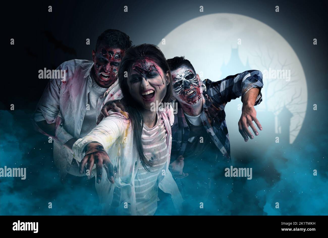 Scary zombies outdoors at night of full moon Stock Photo - Alamy