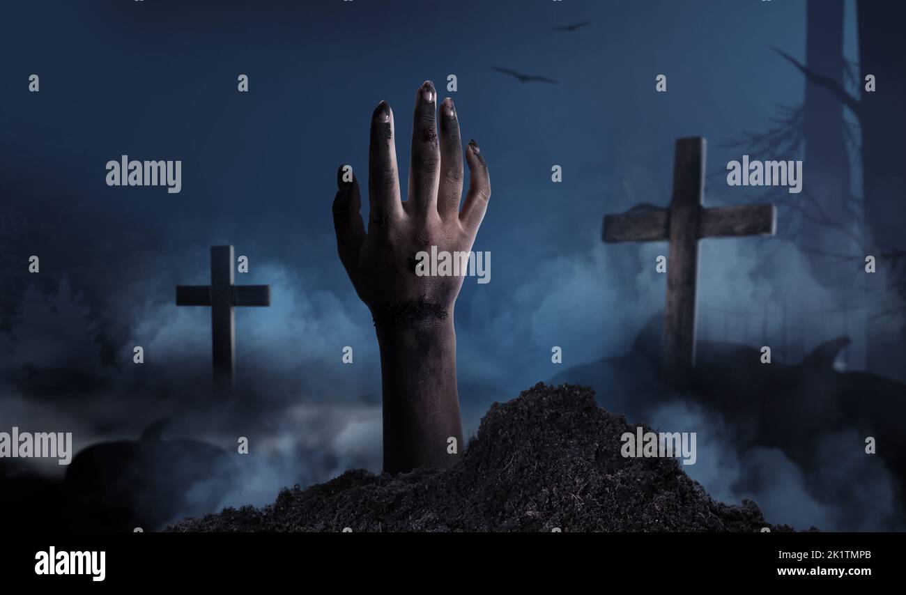 Hand rising out of grave hi-res stock photography and images - Alamy