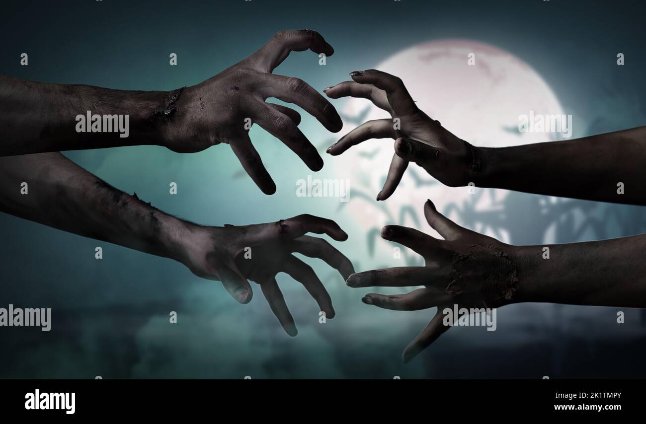 Hands of zombies and full moon in night sky Stock Photo - Alamy