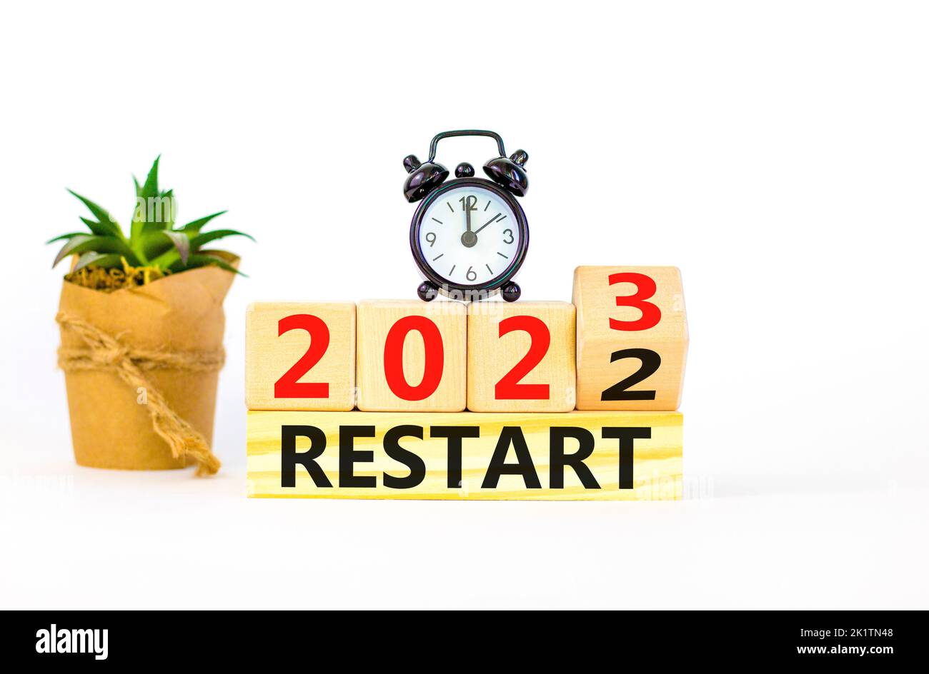 2023 restart new year symbol. Turned wooden cube and changes words ...