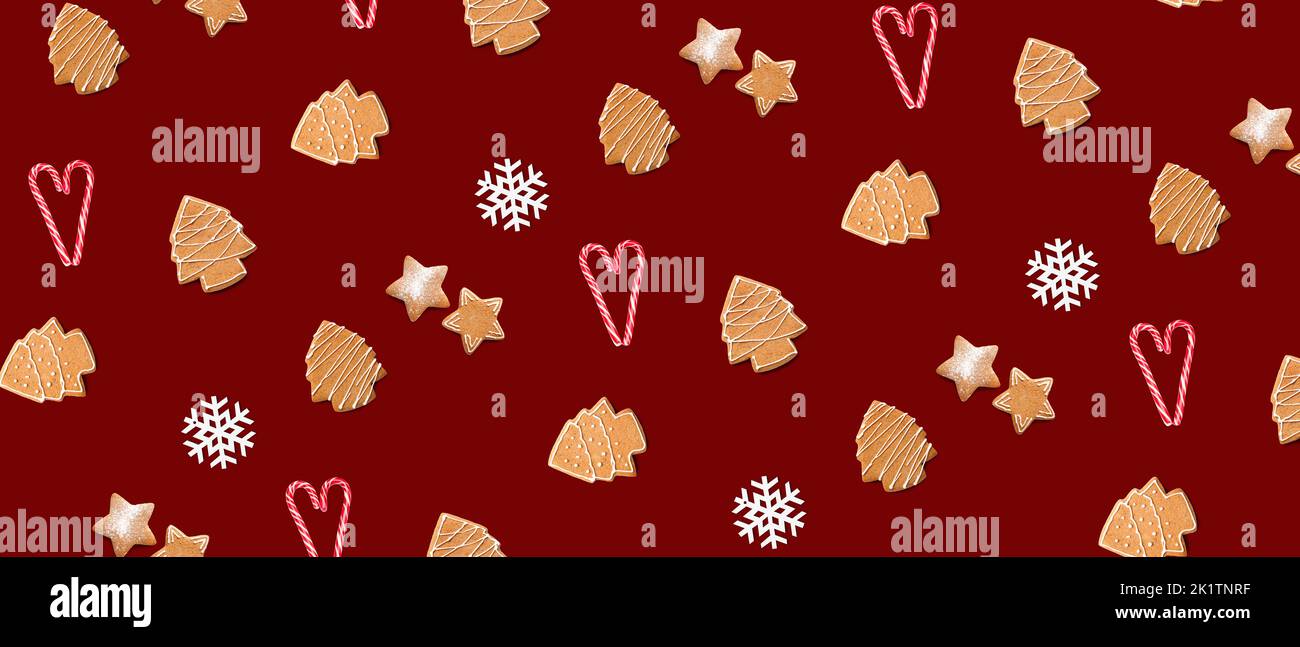 Many Christmas cookies, candy canes and snowflakes on red background ...