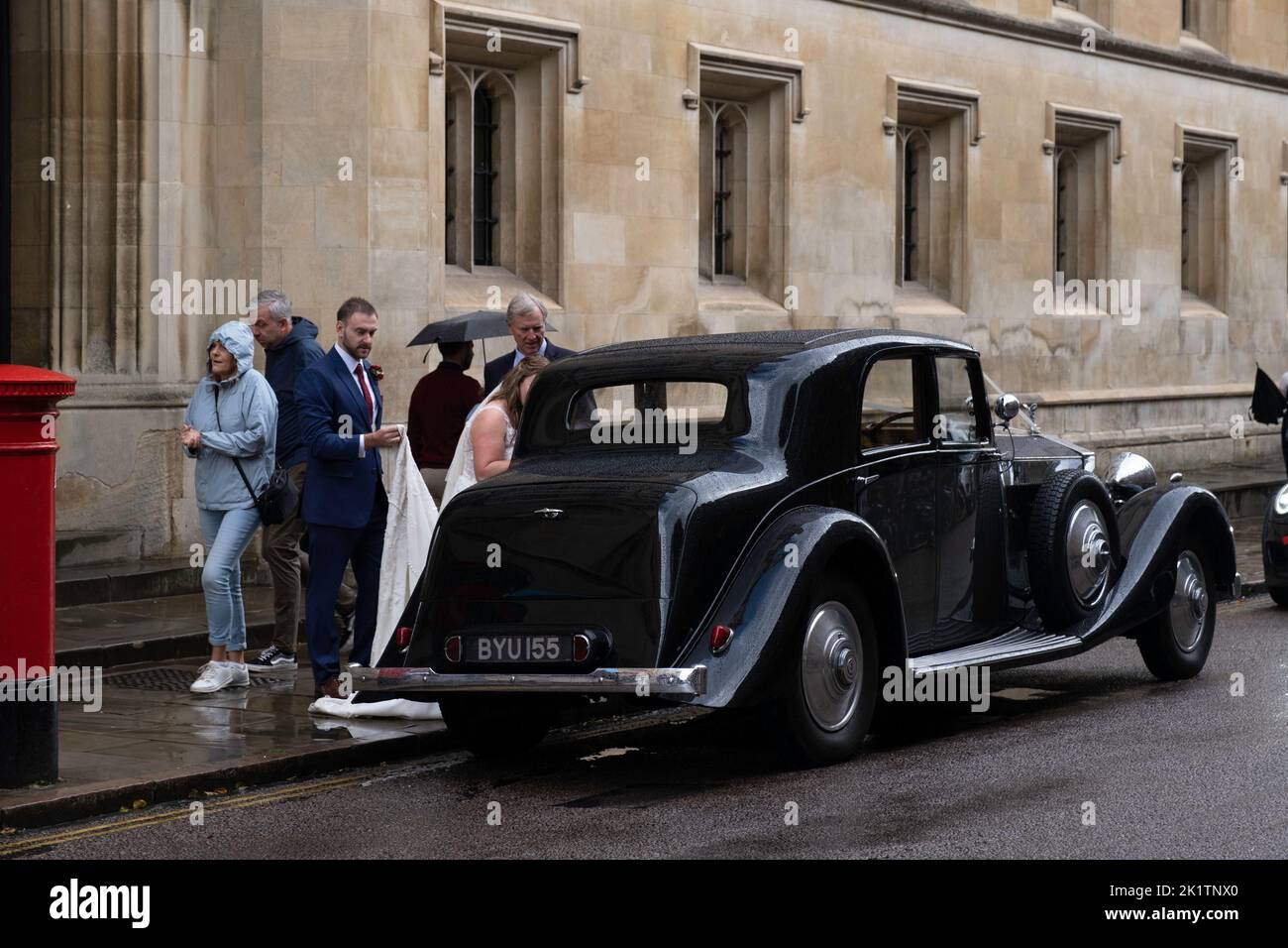 Newly married couple gets into an old-fashioned luxurious and stately ...