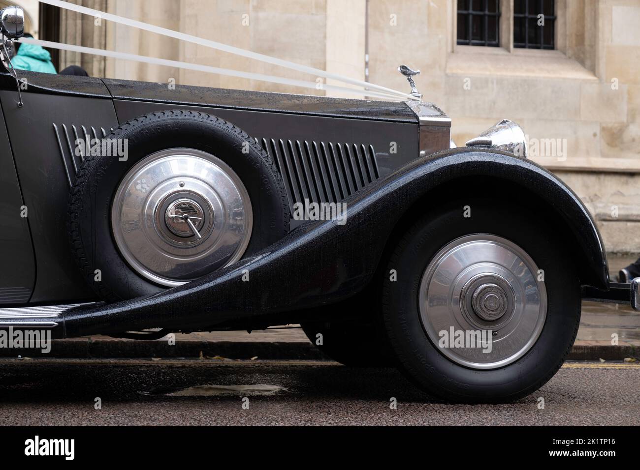 Front part of an old fashioned luxury and stately black car decorated ...