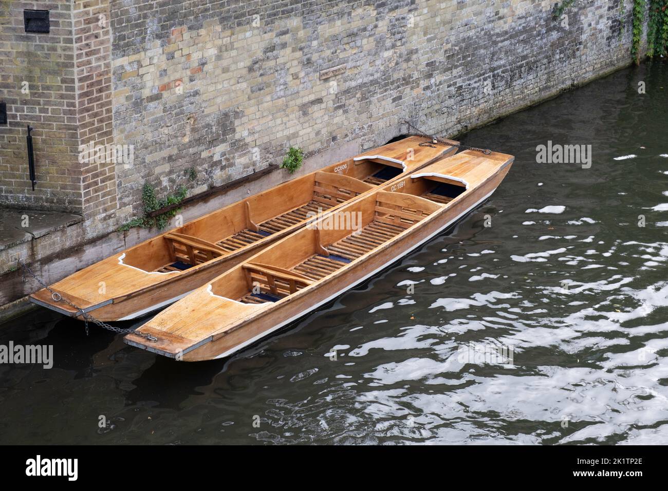 Two punts (a type of wooden boat used for punting) moored on the River ...