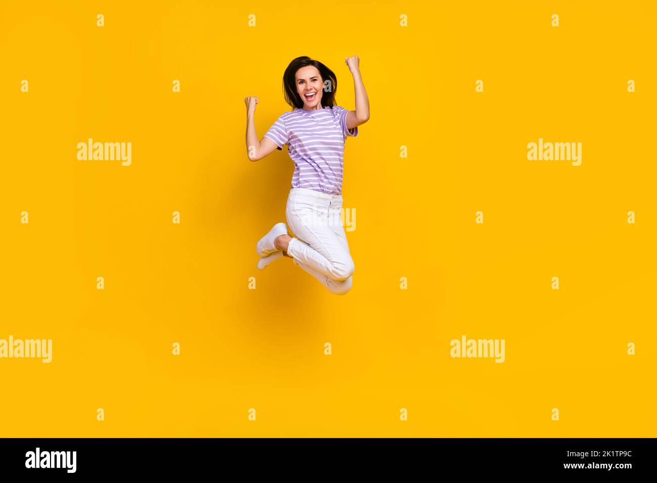 Photo of joyful positive lucky girl lady jump raise arm rejoice ...