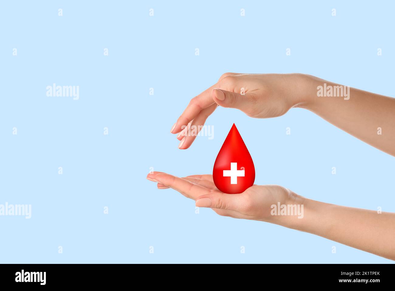 Female hands and drop of blood on light blue background Stock Photo - Alamy