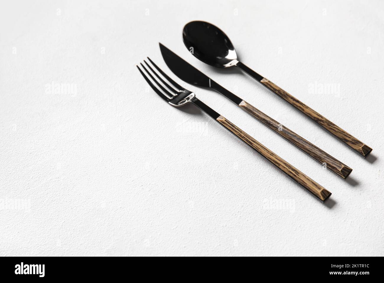 Fork, knife and spoon on white background Stock Photo - Alamy