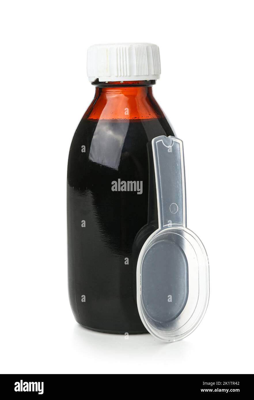 Bottle of cough syrup with spoon on white background Stock Photo - Alamy